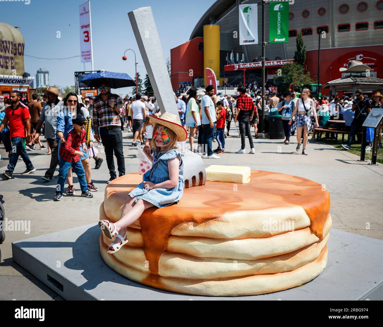 Calgary, Canada. 09th July, 2023. A young sits on a stack of pancakes ...