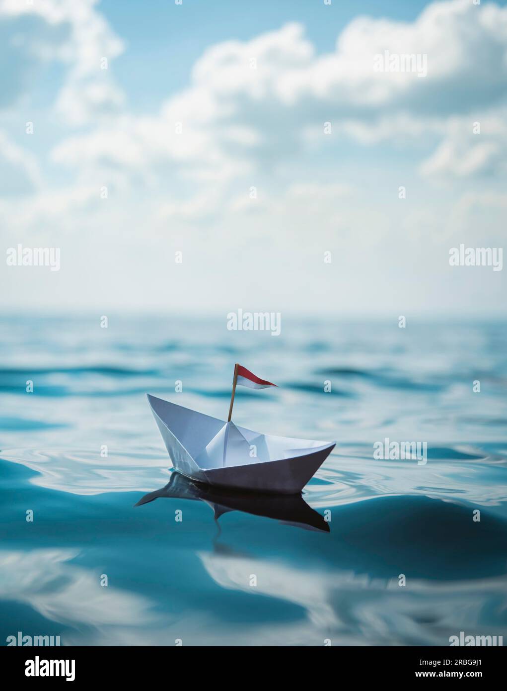 Paper ship on the sea Stock Photo - Alamy