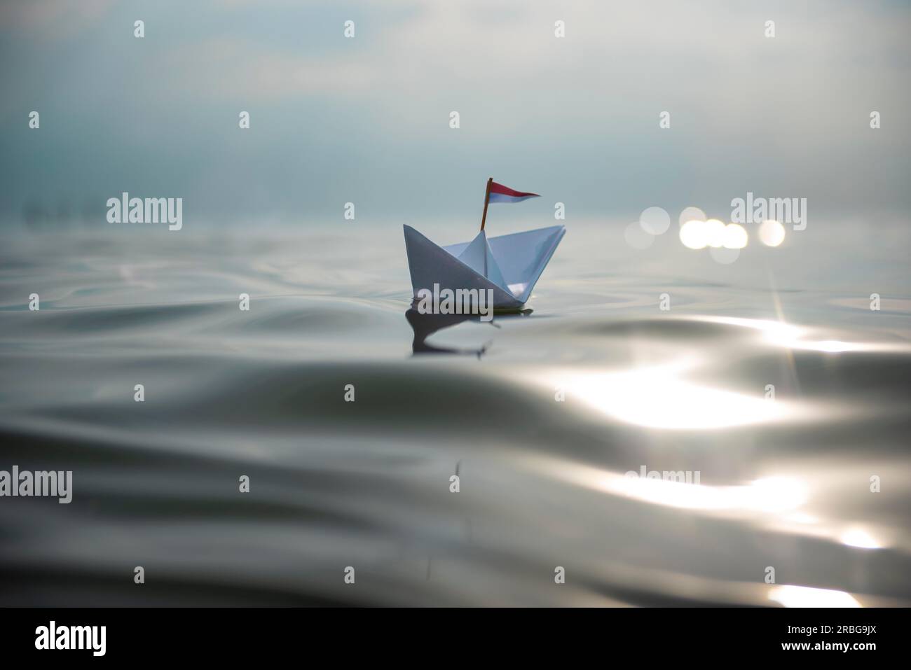 Paper ship on the sea Stock Photo - Alamy