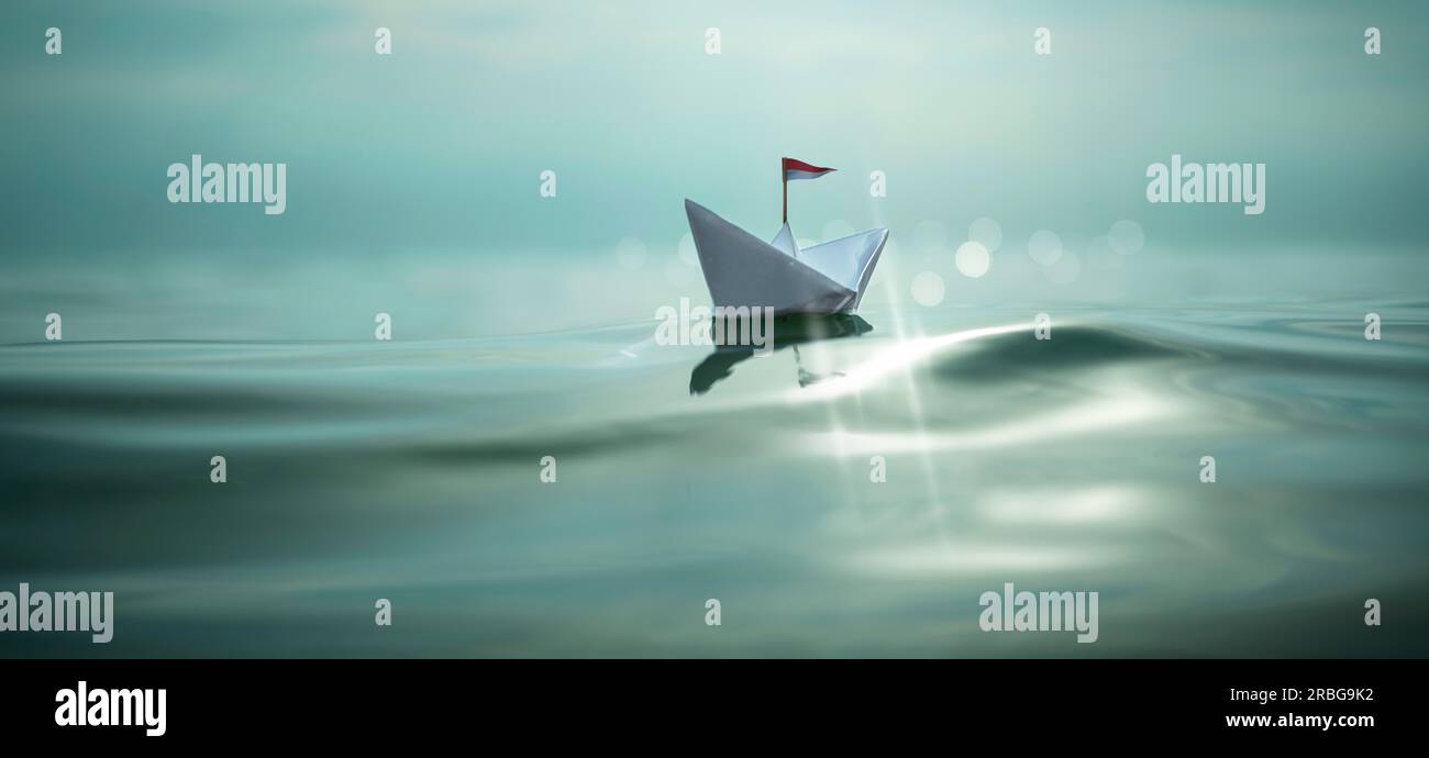 Paper ship on the glittering sea Stock Photo - Alamy