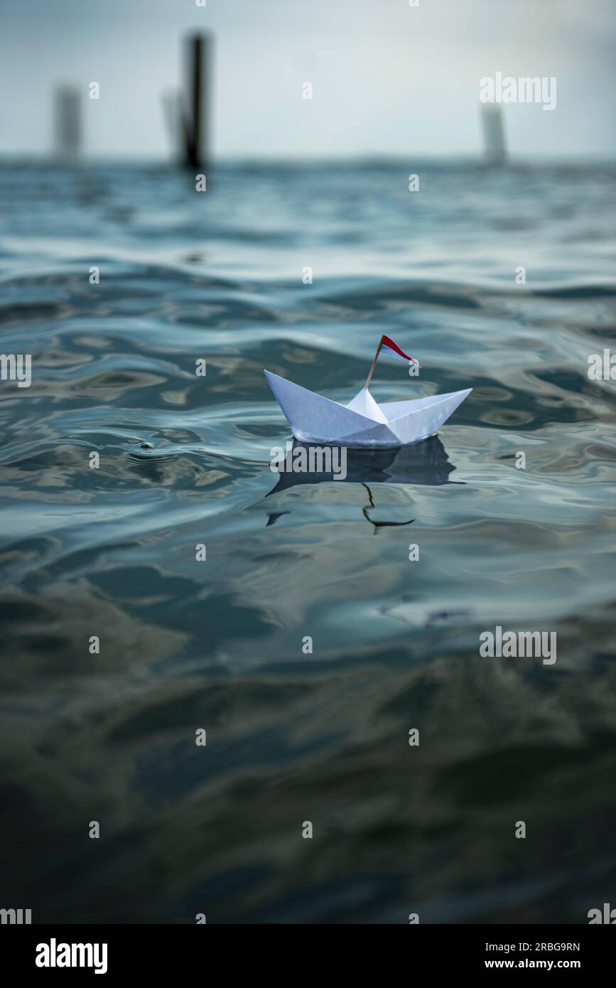 Paper ship on the sea Stock Photo - Alamy
