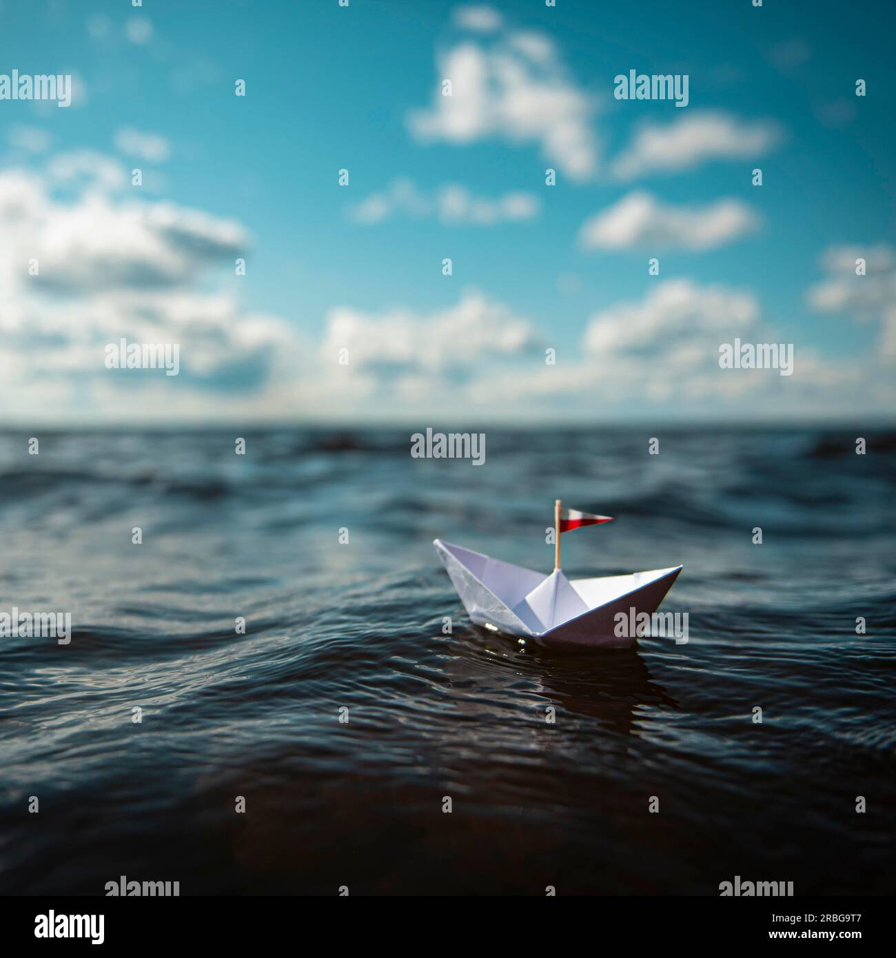 Paper boat in big waves Stock Photo - Alamy