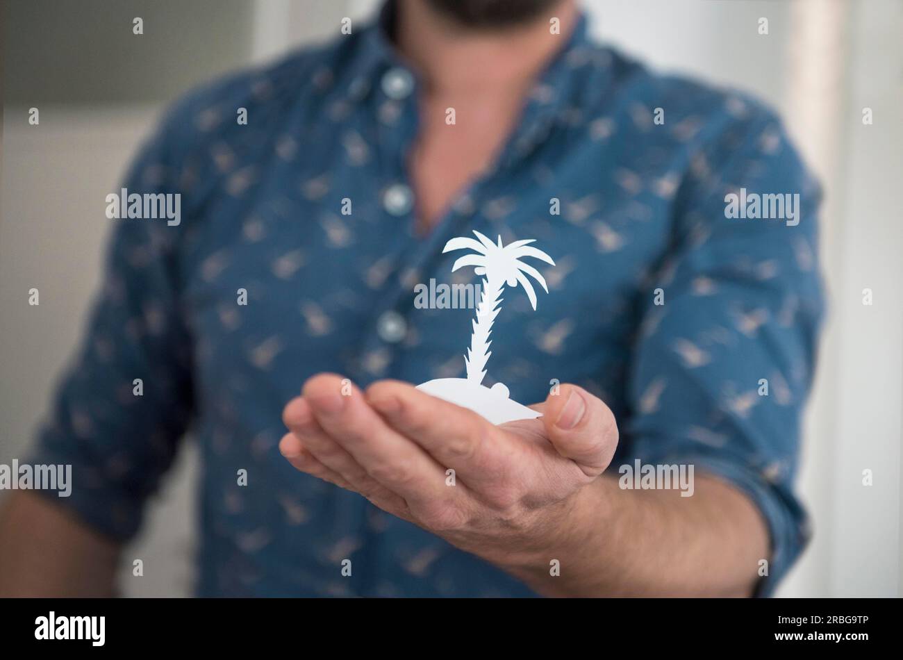 Man with cut out island Stock Photo - Alamy