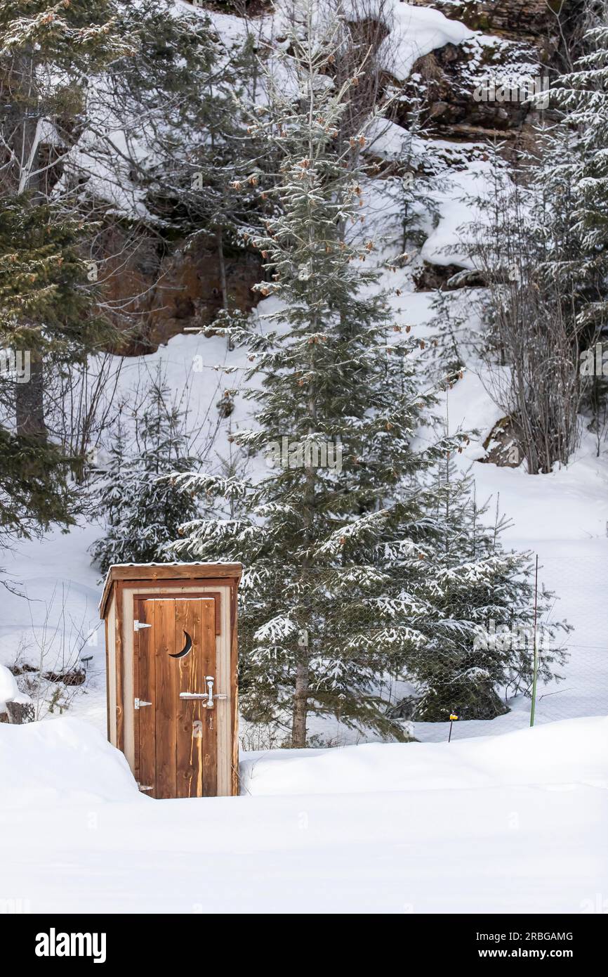 An outhouse in a wintry scene Stock Photo - Alamy