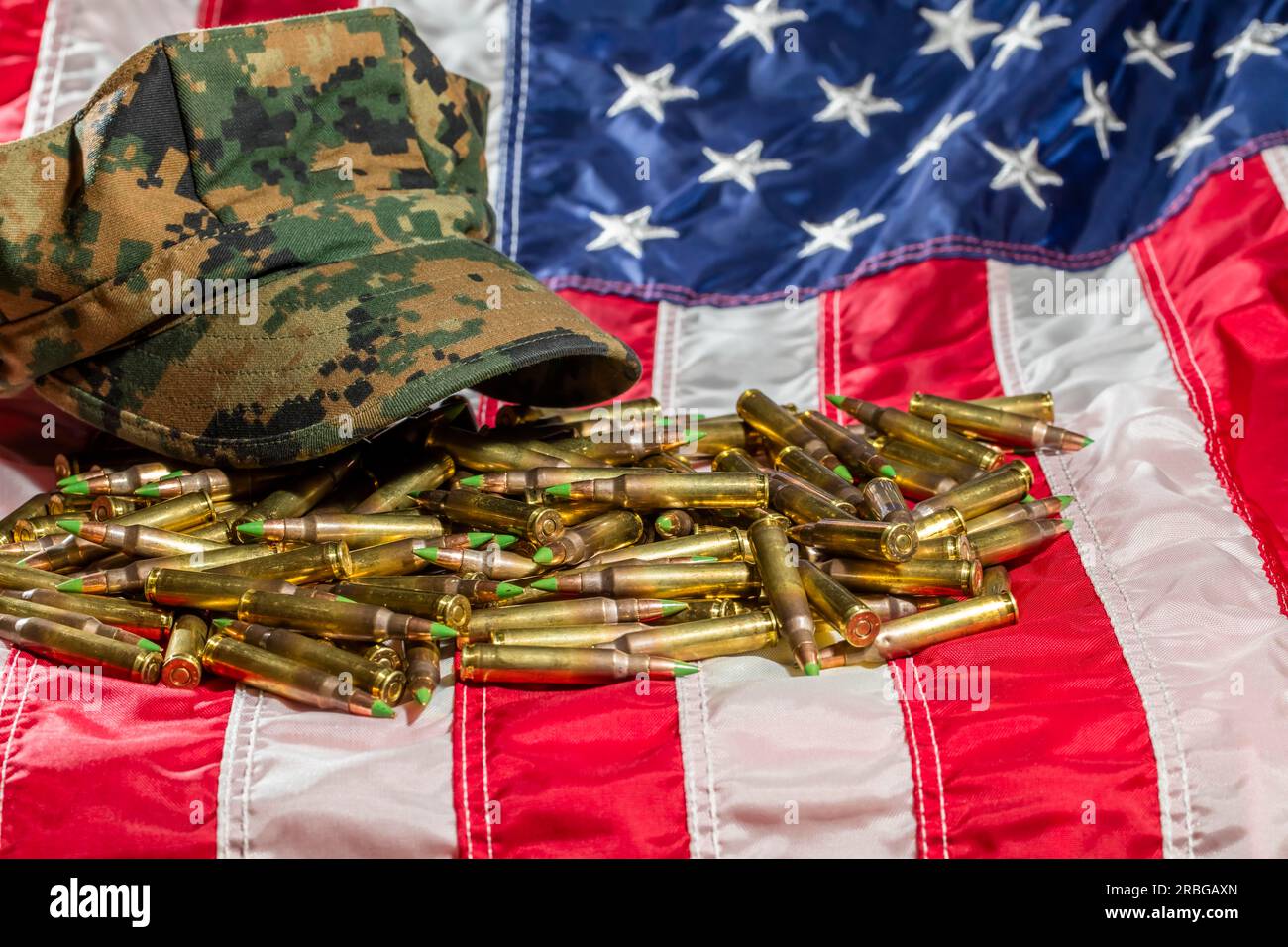 Military cover on an American Flag with rifle ammunition Stock Photo ...