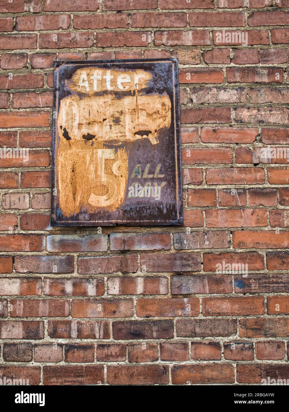 Vintage rusted parking sign on a brick building Stock Photo - Alamy