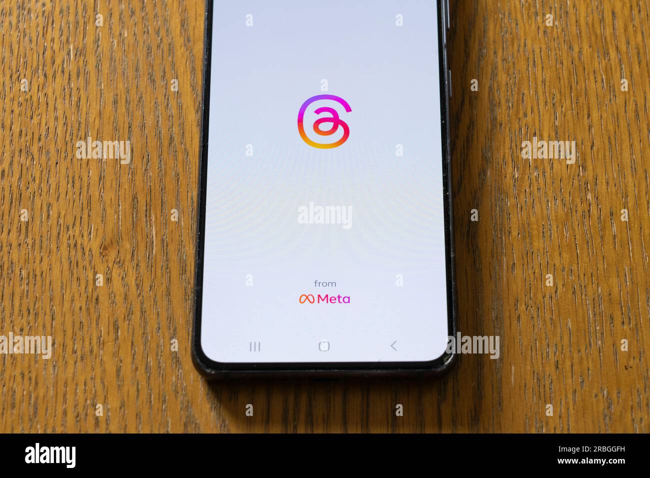 Closeup on a smartphone screen showing the Instagram-like coloured logo ...