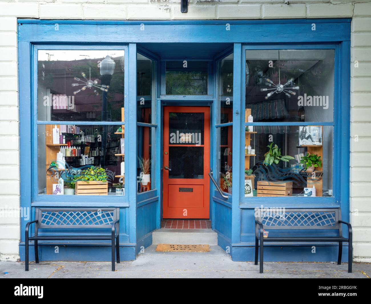 Blue and red painted store in a small town Stock Photo - Alamy
