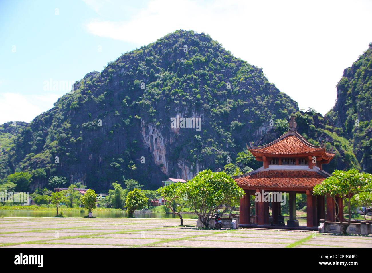 Red temple among the jungle mountains on a sunny day. Ideal to ...