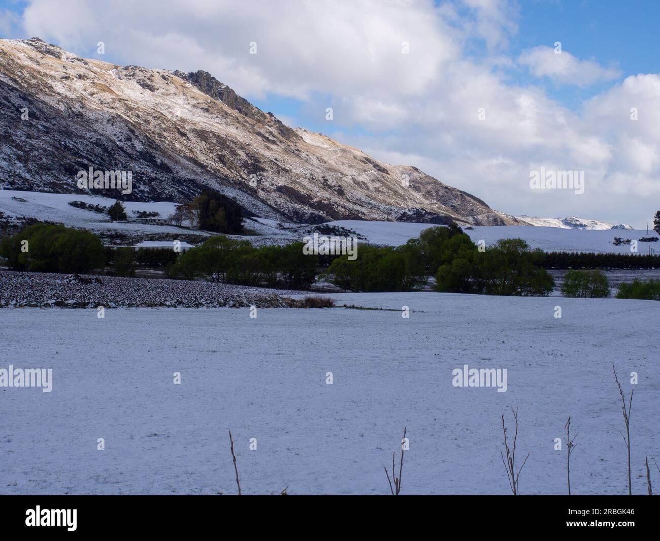 Snow Covered Paddock And Hills Stock Photo - Alamy