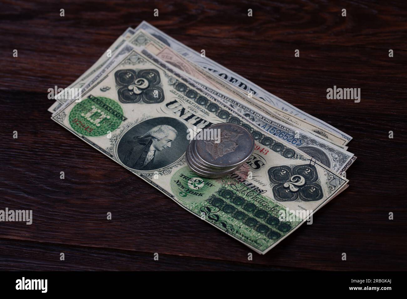 Old west US banknotes and silver certificates with silver dollar coins ...