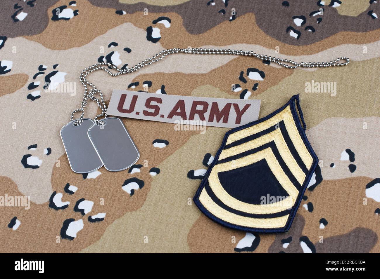 US ARMY Sergeant First Class rank patch and dog tags on desert ...