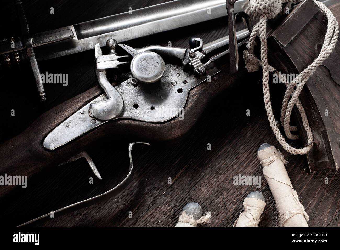 Flintlock musket with powder flask and led bullets on wooden deck Stock ...