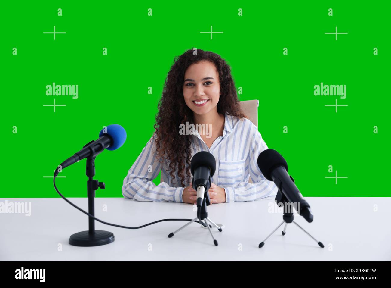 Chroma key compositing. Woman giving interview during news conference ...