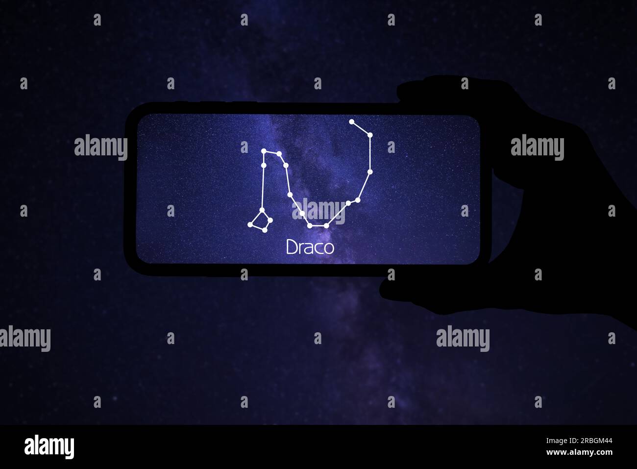 Woman using stargazing app on her phone at night, closeup. Identified ...