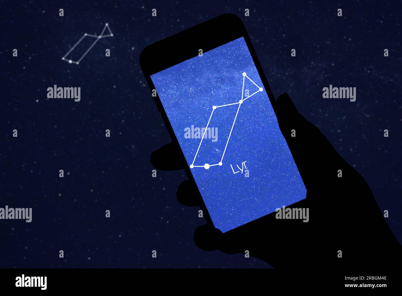 Woman using stargazing app on her phone at night, closeup. Identified ...