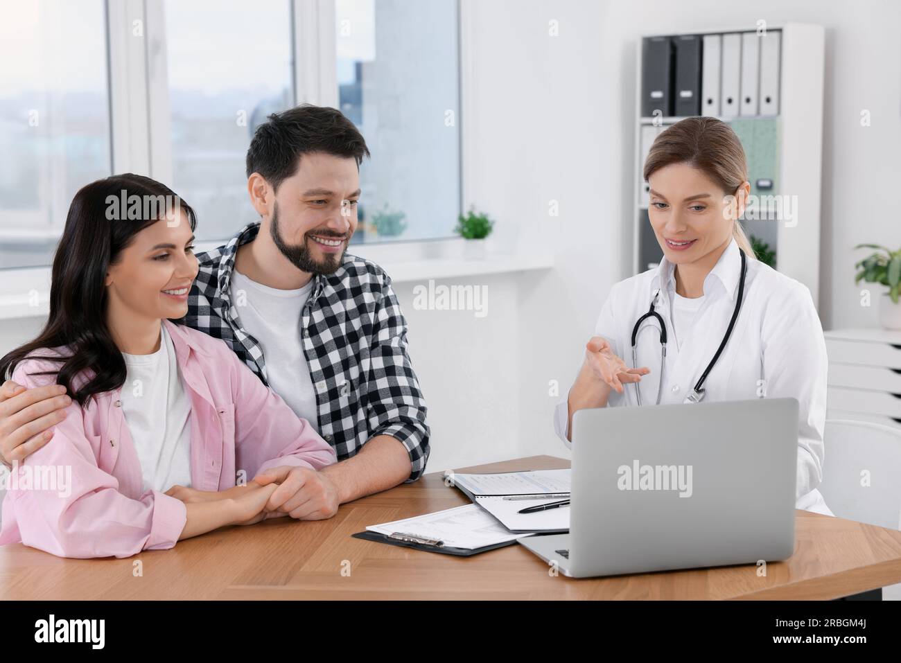 Couple having appointment with fertility doctor in clinic. Patient ...