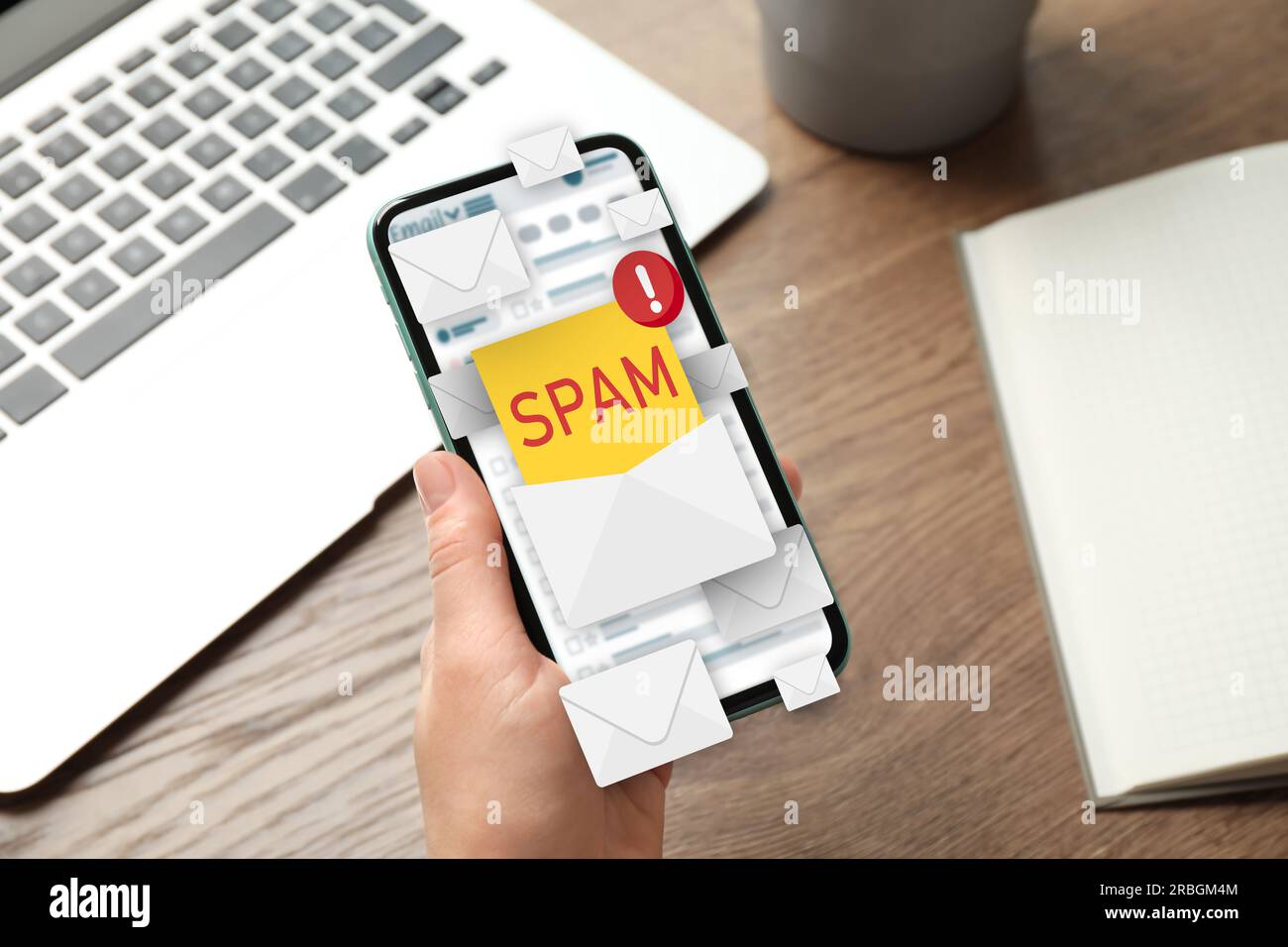 Spam warning message, envelope illustrations popping out of device display. Woman using email ...