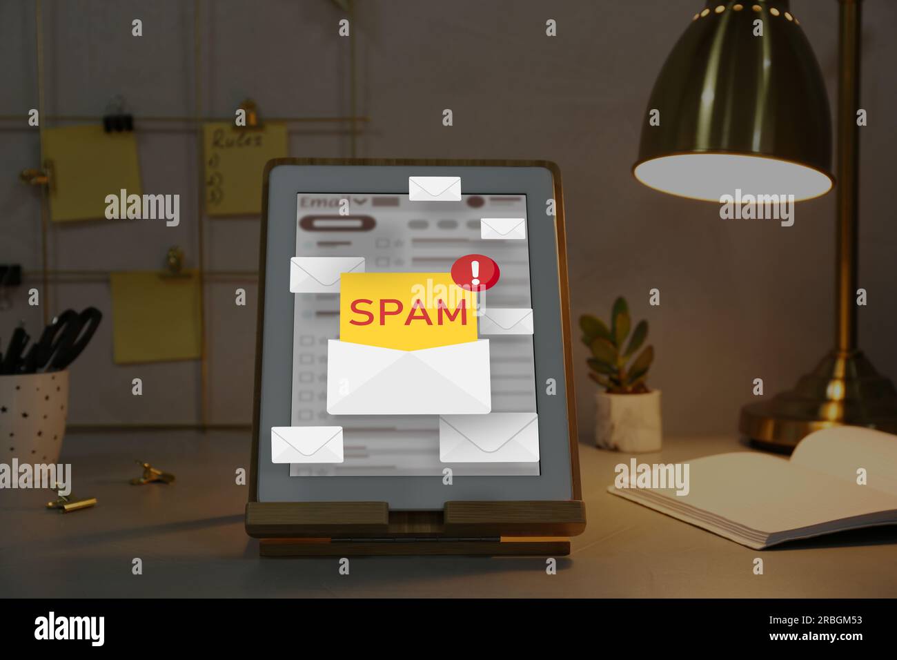 Spam warning message in email software. Envelope illustrations popping out of tablet display on ...