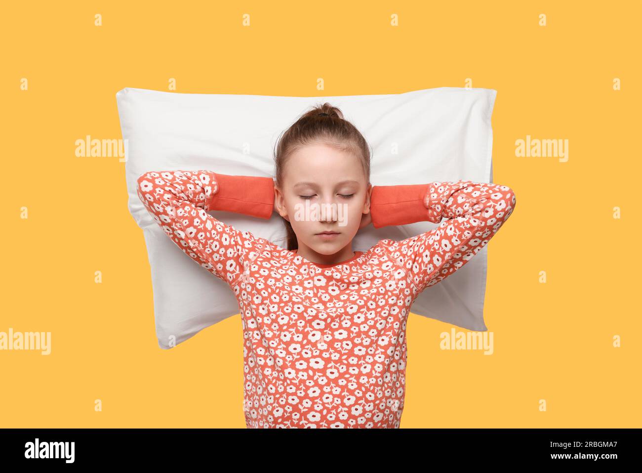 Sleepy girl on orange hi-res stock photography and images - Alamy