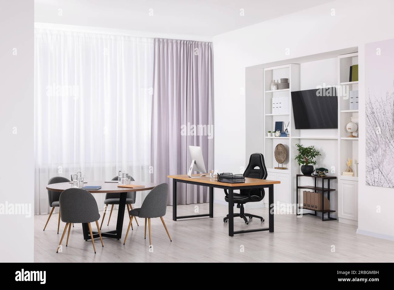 Stylish office with comfortable furniture and tv zone. Interior design ...