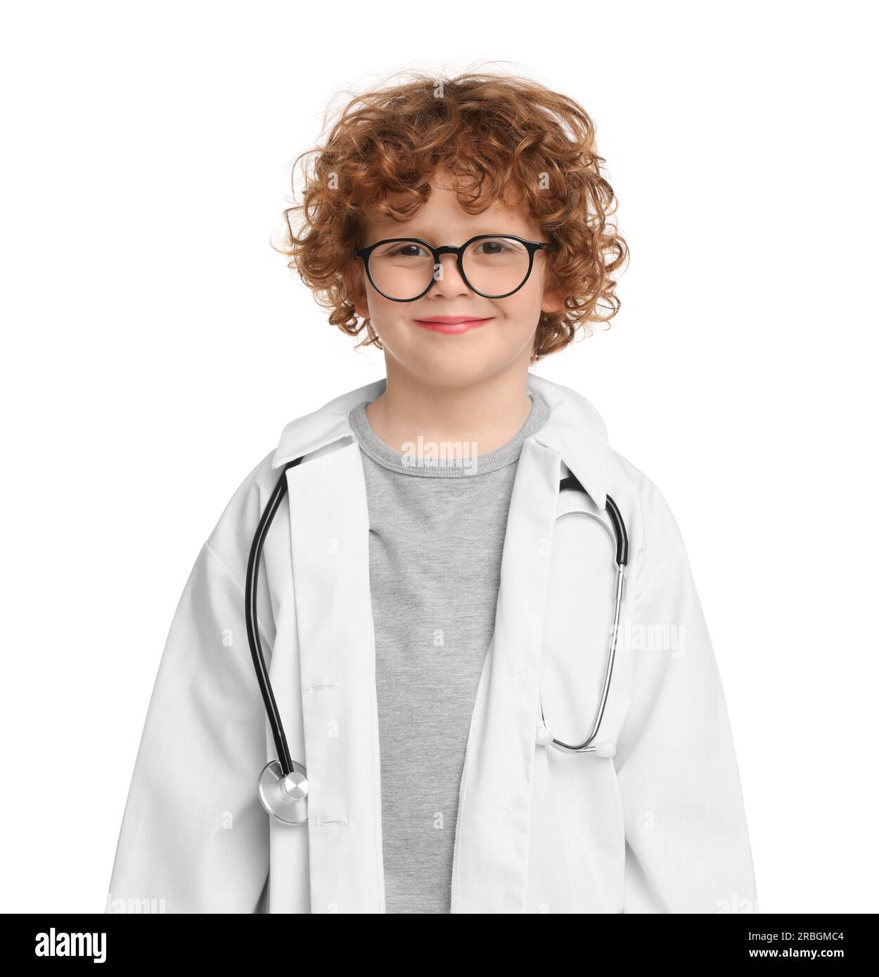 Little boy in medical uniform with stethoscope on white background ...