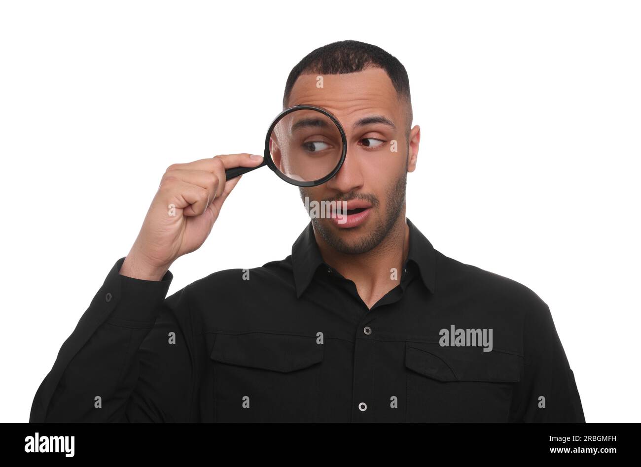 Surprised man looking through magnifier glass on white background Stock ...