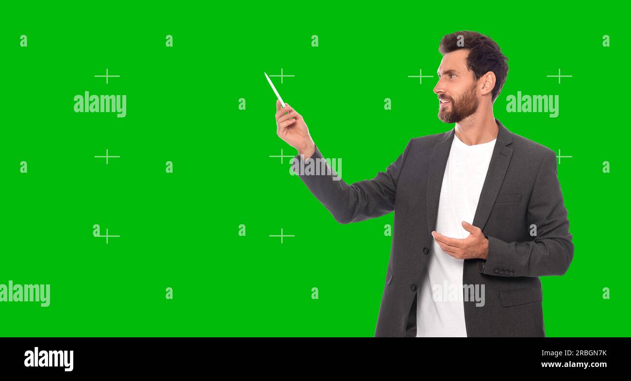 Chroma key compositing. Broadcaster against green screen, banner design ...