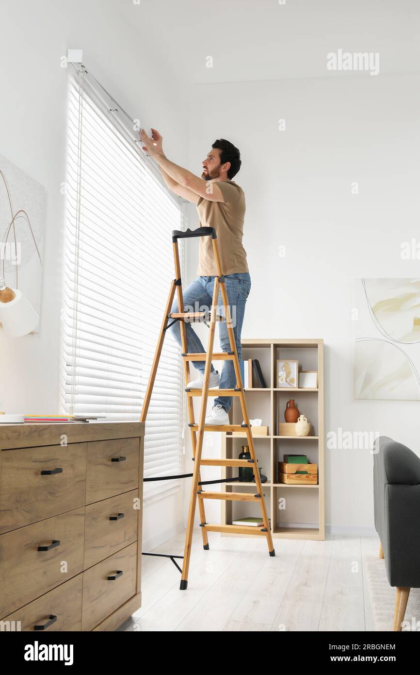 Installing blinds hi-res stock photography and images - Alamy