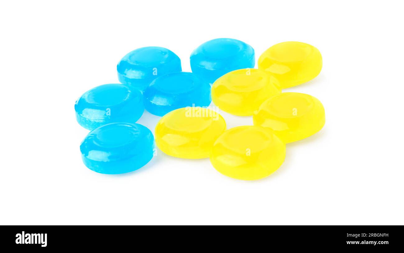 Many colorful cough drops on white background Stock Photo - Alamy