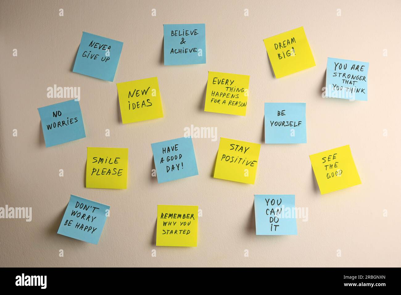 Paper notes with life-affirming phrases on white wall Stock Photo - Alamy