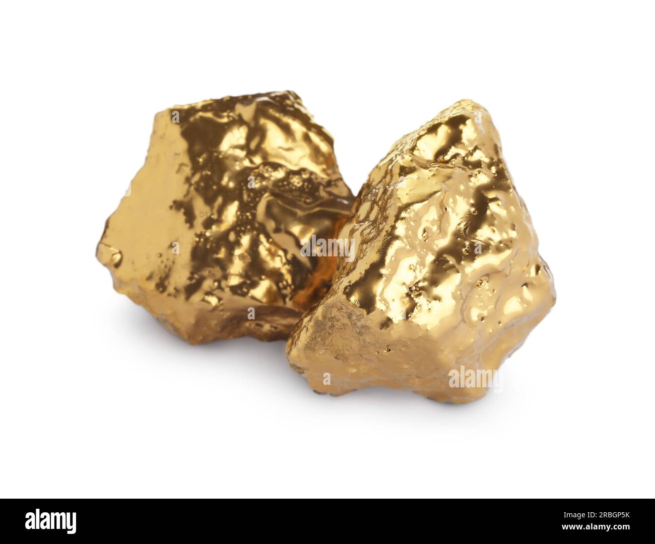 Two shiny gold nuggets on white background Stock Photo - Alamy