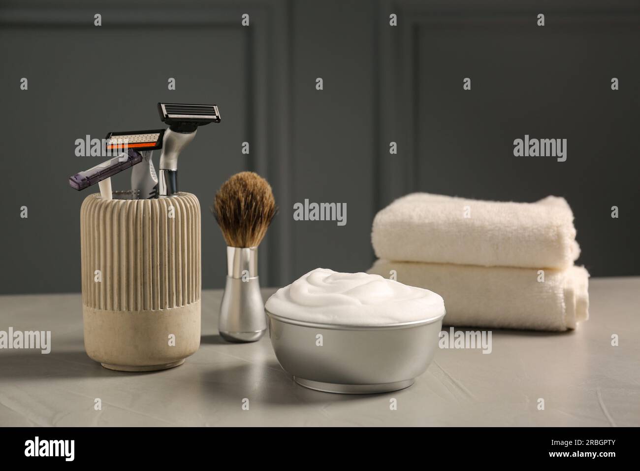 Set of men's shaving tools on grey table Stock Photo - Alamy