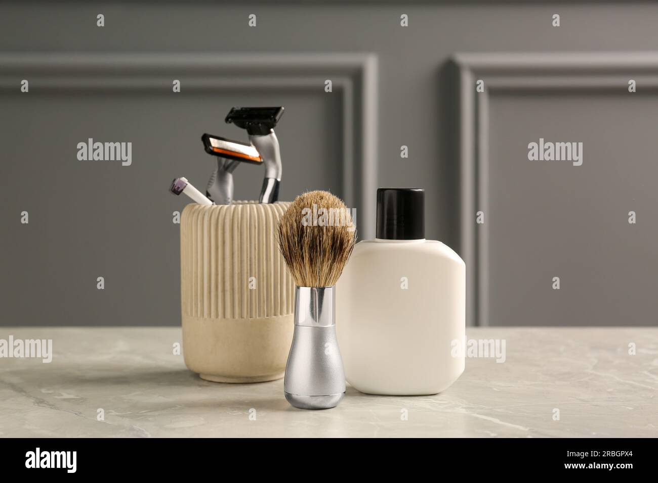 Set of men's shaving tools on grey marble table Stock Photo - Alamy