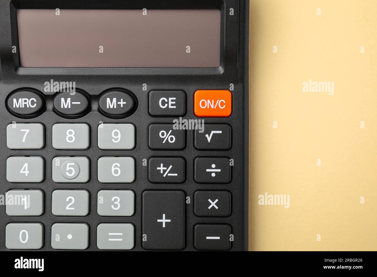 Calculator on beige background, top view. Office equipment Stock Photo ...