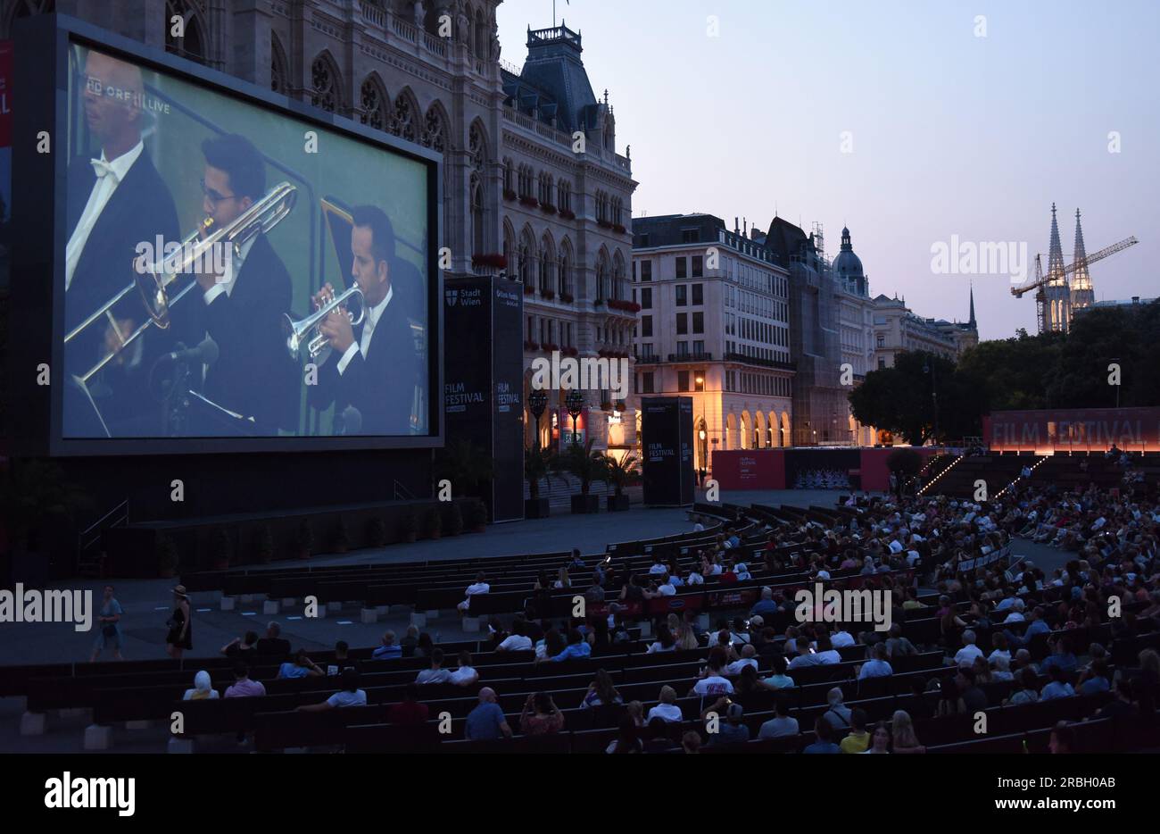 Vienna, Austria. 9th July, 2023. People watch a concert film during the ...