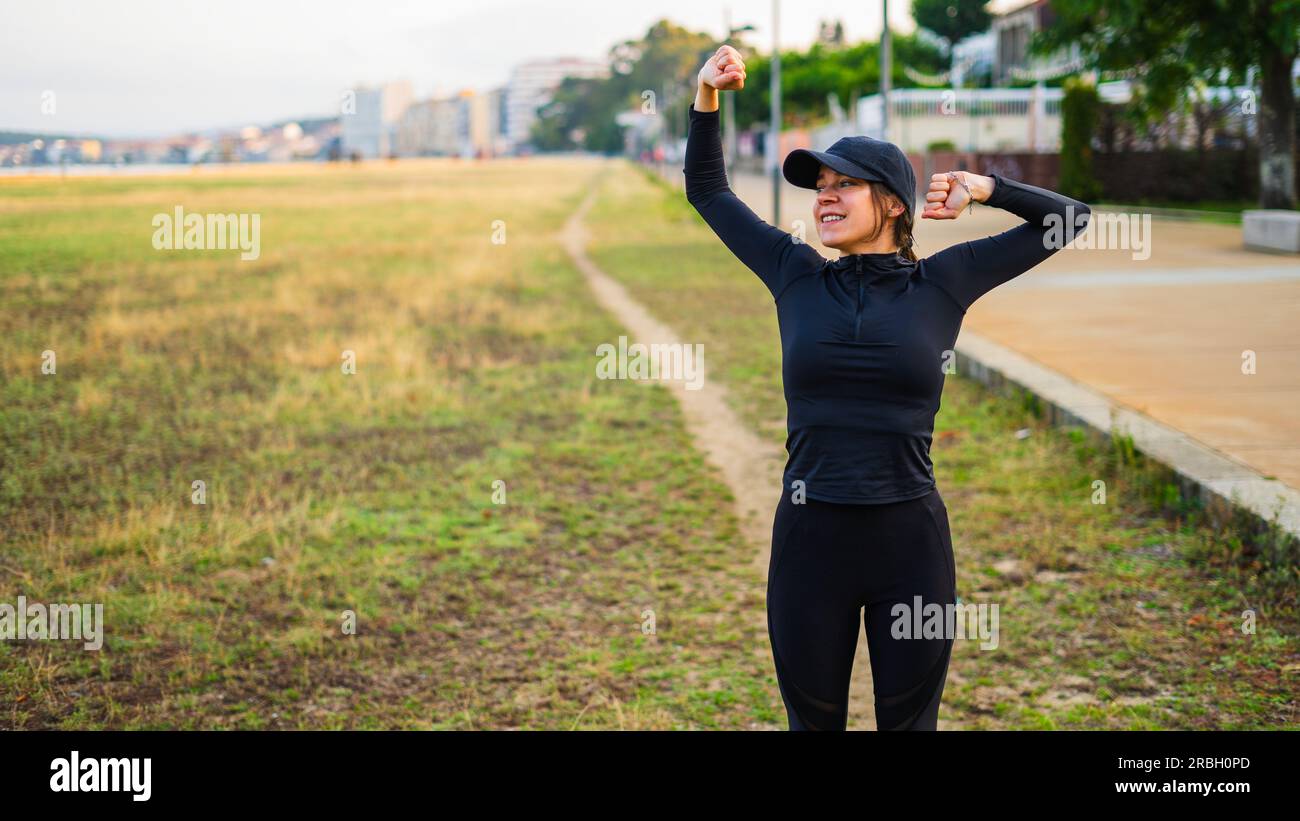 girl doing exercise early in the morning and stretching herself on the ...