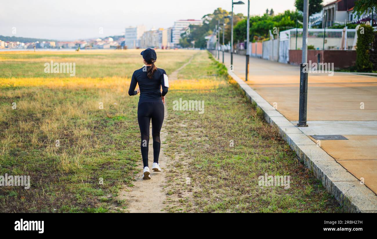 girl jogging early in the morning as part of her morning routine Stock ...