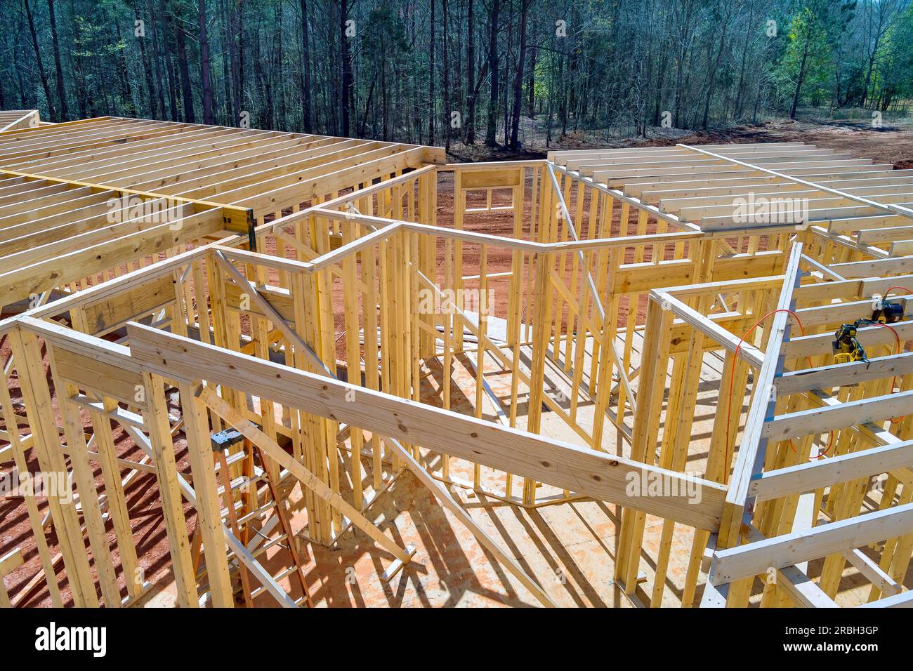 Aerial view of a building under construction, wood stick frame in ...