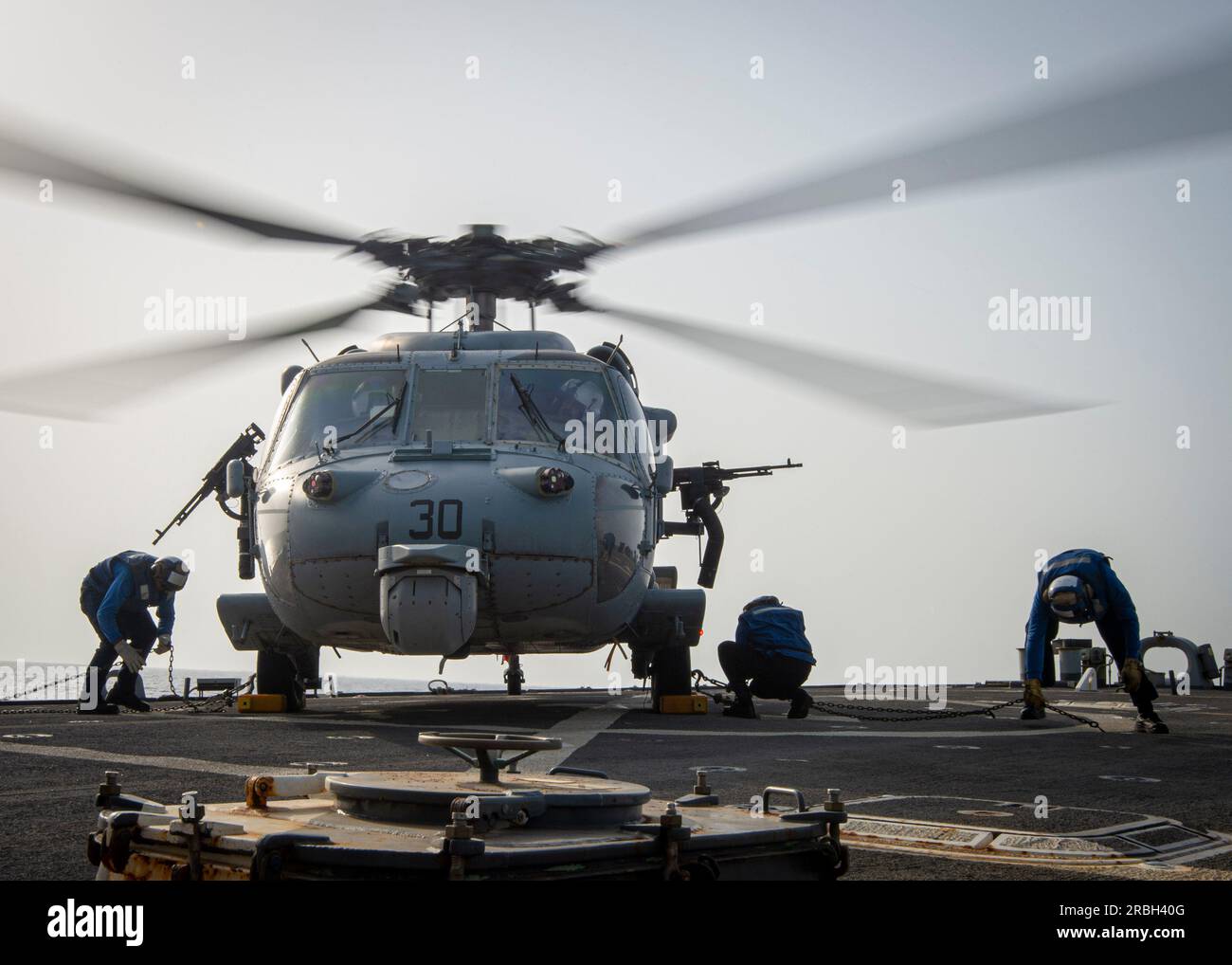 230706-N-NH267-1069 GULF OF OMAN (July 6, 2023) Sailors chain down an ...