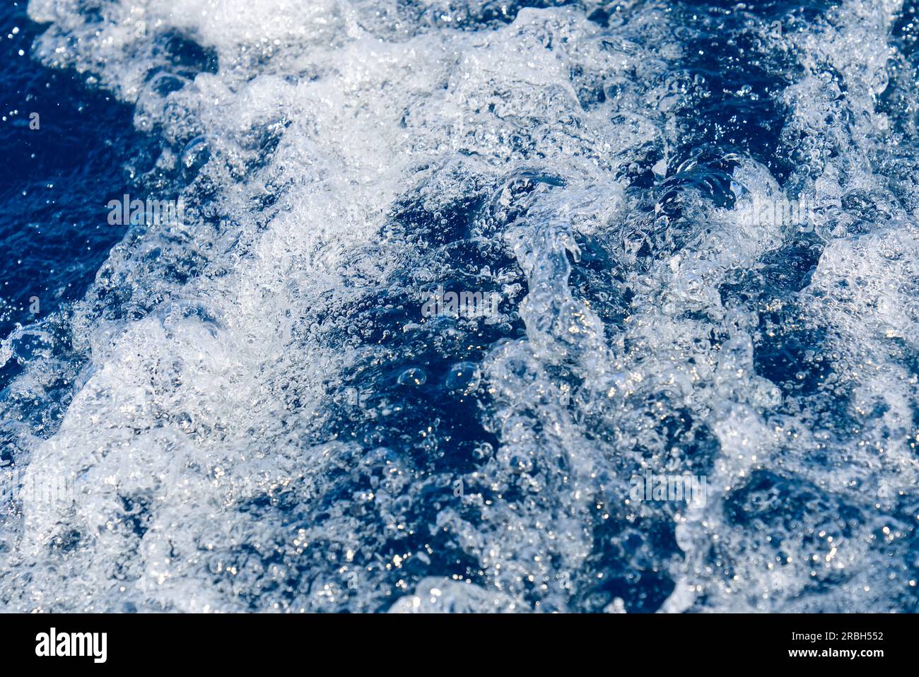 Abstract blue sea water with white waves. Blue sea texture with waves ...