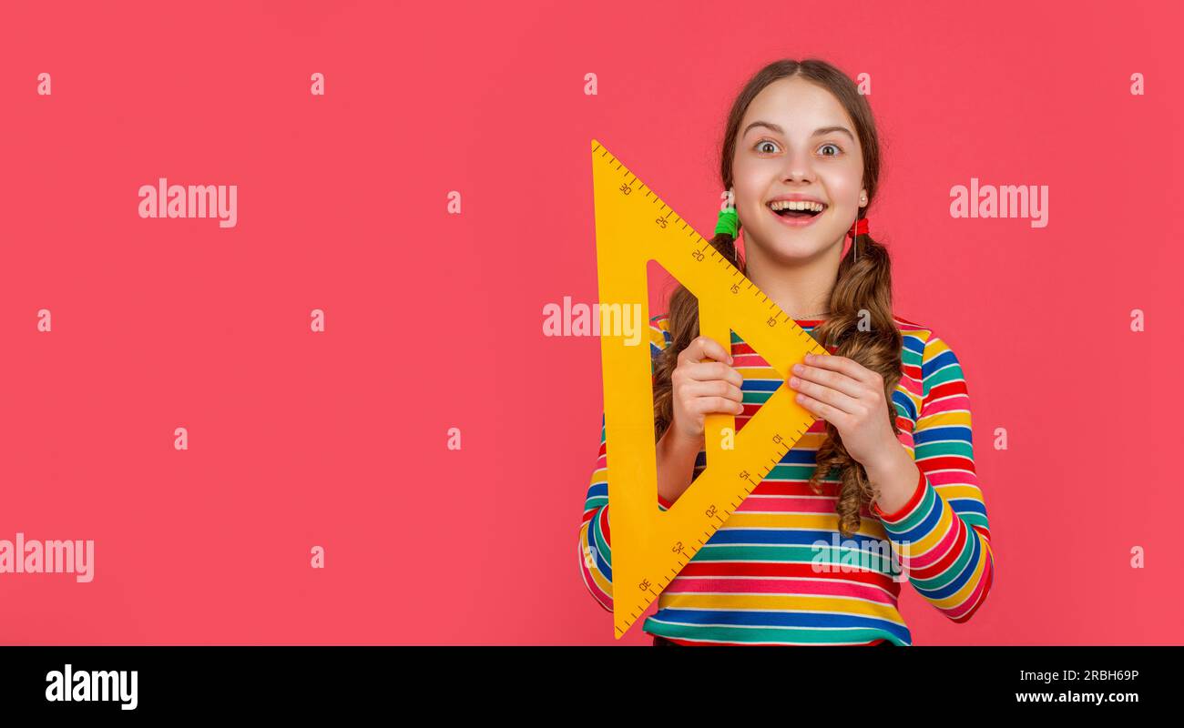 amazed school child hold math tool of triangle Stock Photo - Alamy