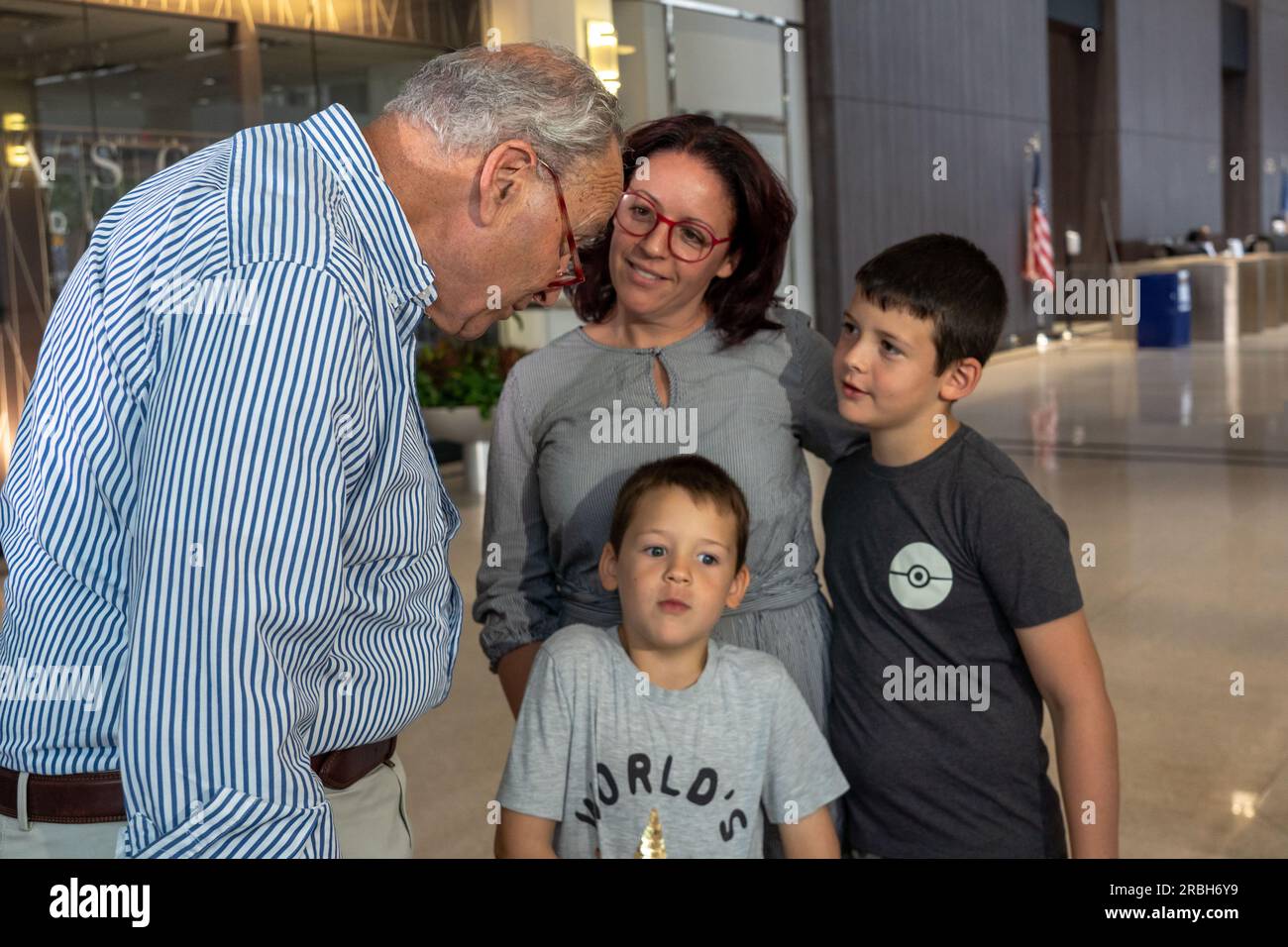 Senator Chuck Schumer talks with 9 years old Bennett and 6 years old ...