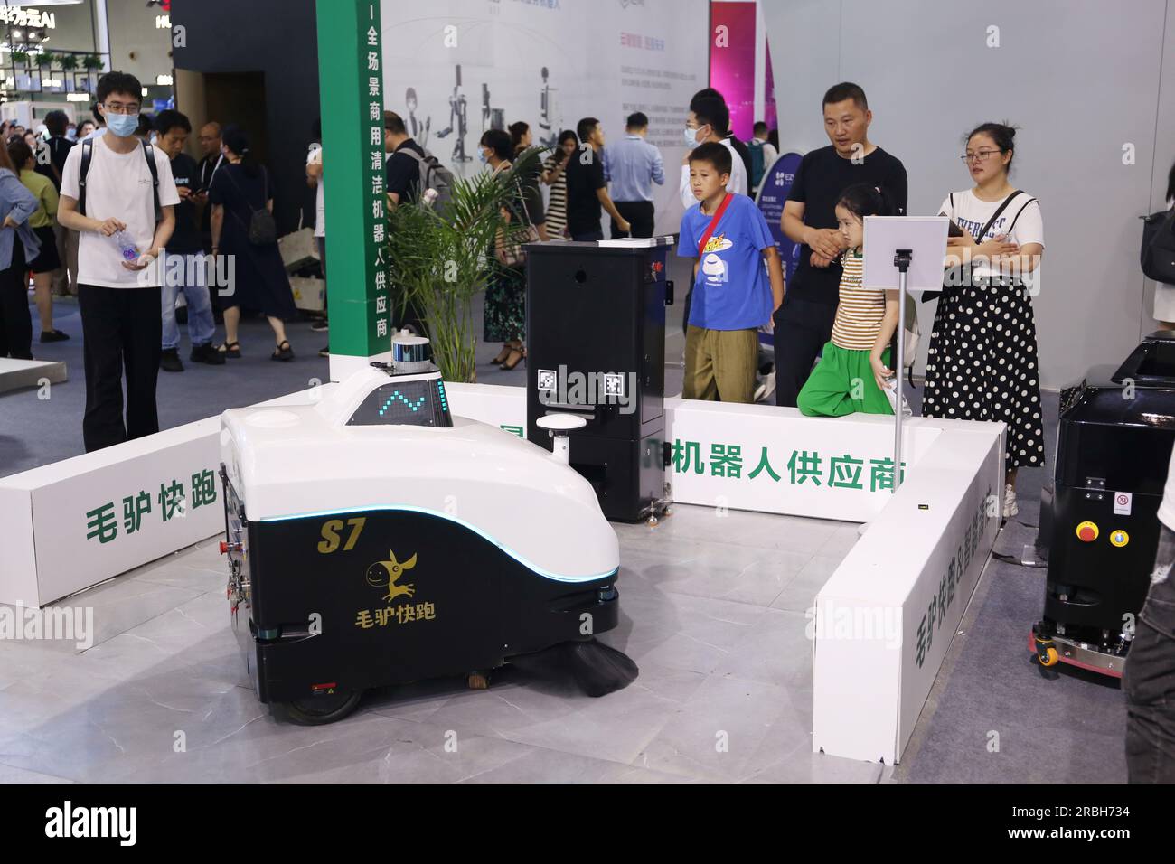 SHANGHAI, CHINA - JULY 6, 2023 - Visitors visit a robot vacuum cleaner ...