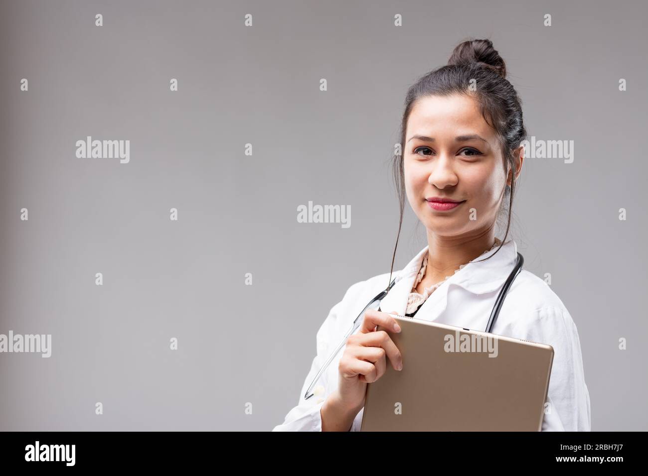 Portrait of a beautiful young Filipino doctor who reassures with a ...