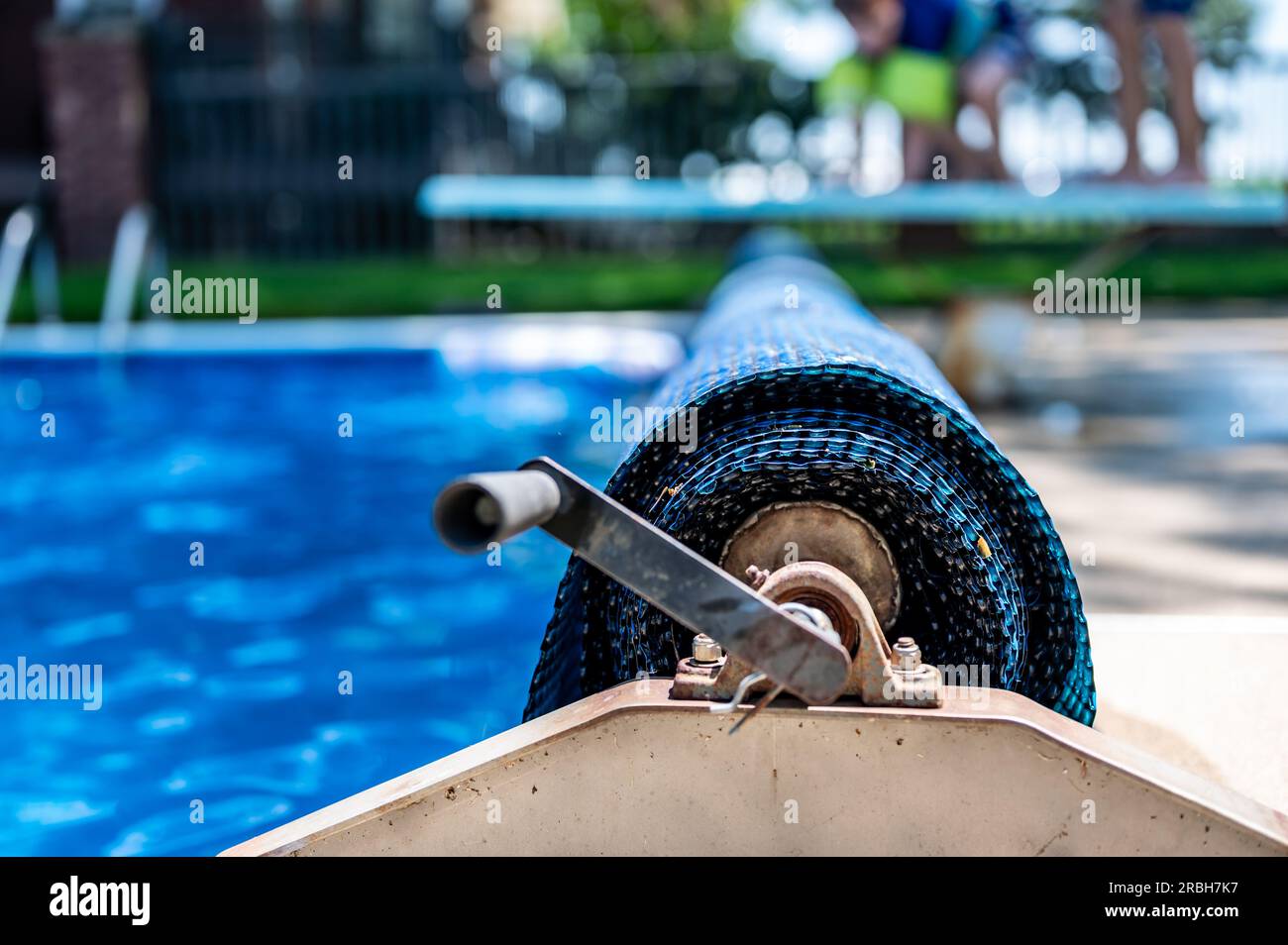 Manual real for a retractable floating pool cover to keep out leaves ...