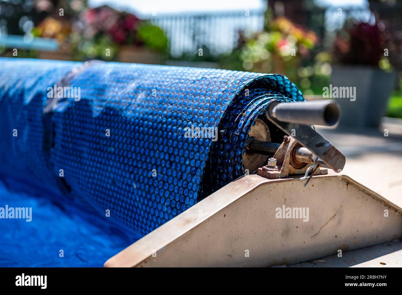 Manual real for a retractable floating pool cover to keep out leaves ...