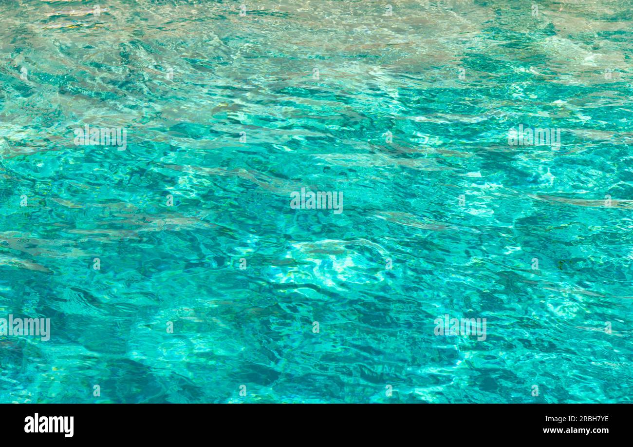 defocused summer pool summertime background with ripples. defocused ...