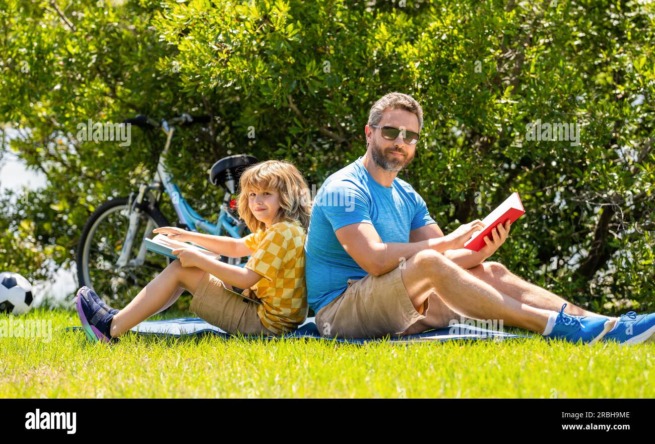 special moment for father and son. Father and son reading time. Father ...