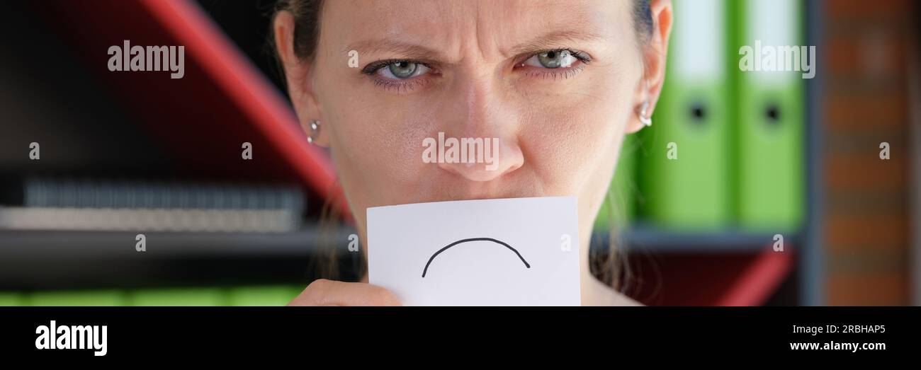 Grumpy woman covering face with paper unhappy emoticon symbol Stock ...